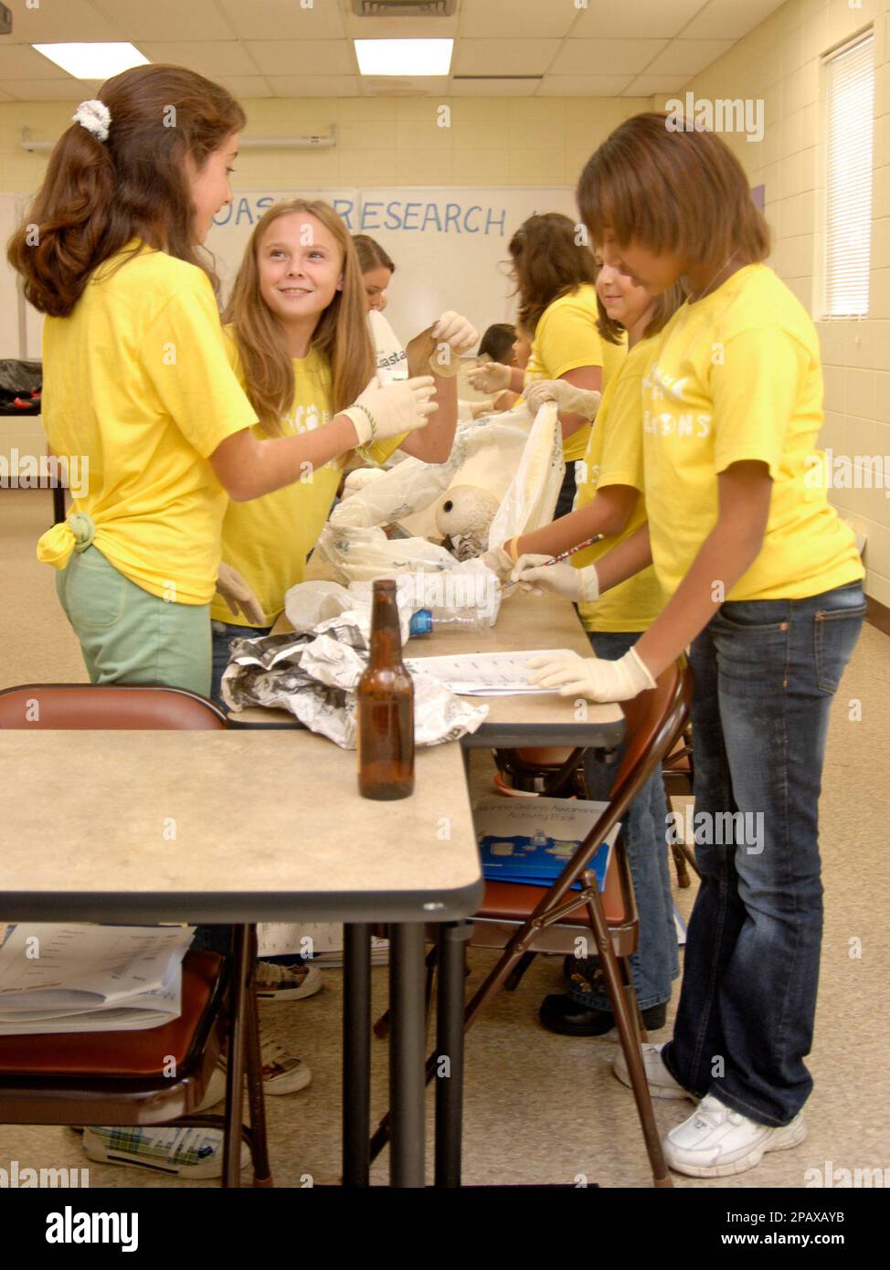Fifth-grade students, from left, Jade Kindsvater, Brittany Barrett and ...