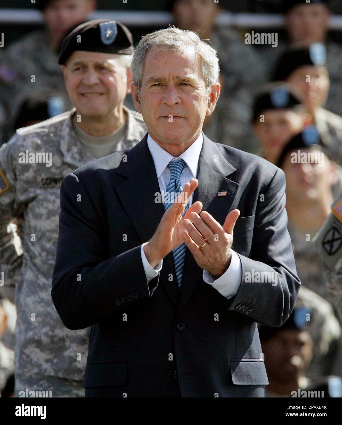 President Bush claps as base commander Brigadier General James H ...