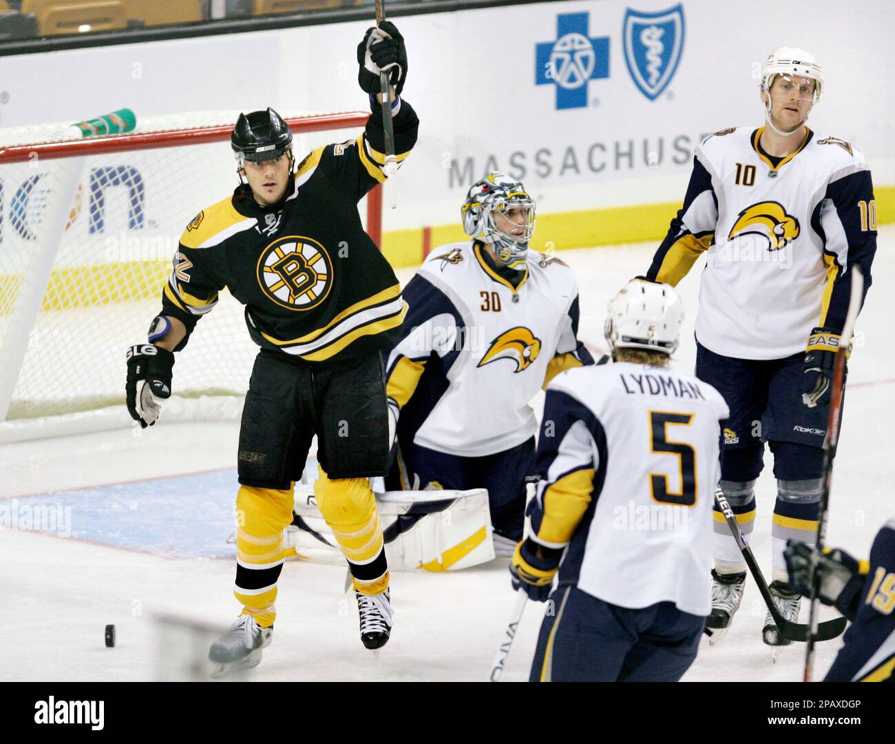 Boston Bruins forward Chuck Kobasew, left, celebrates a goal by ...