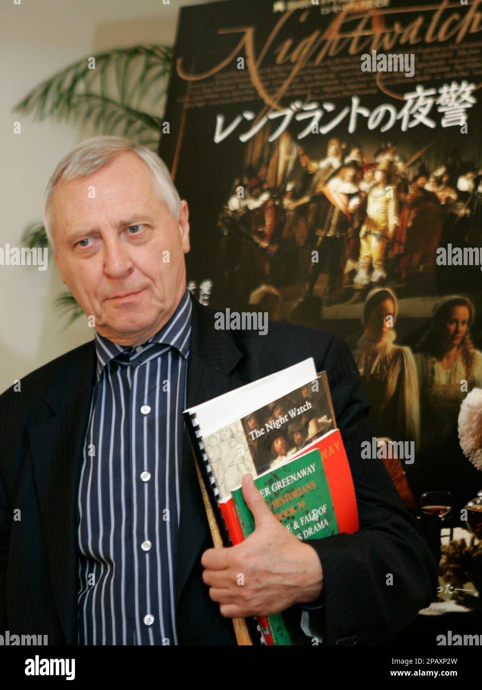 British film director Peter Greenaway poses in front of a poster of his ...
