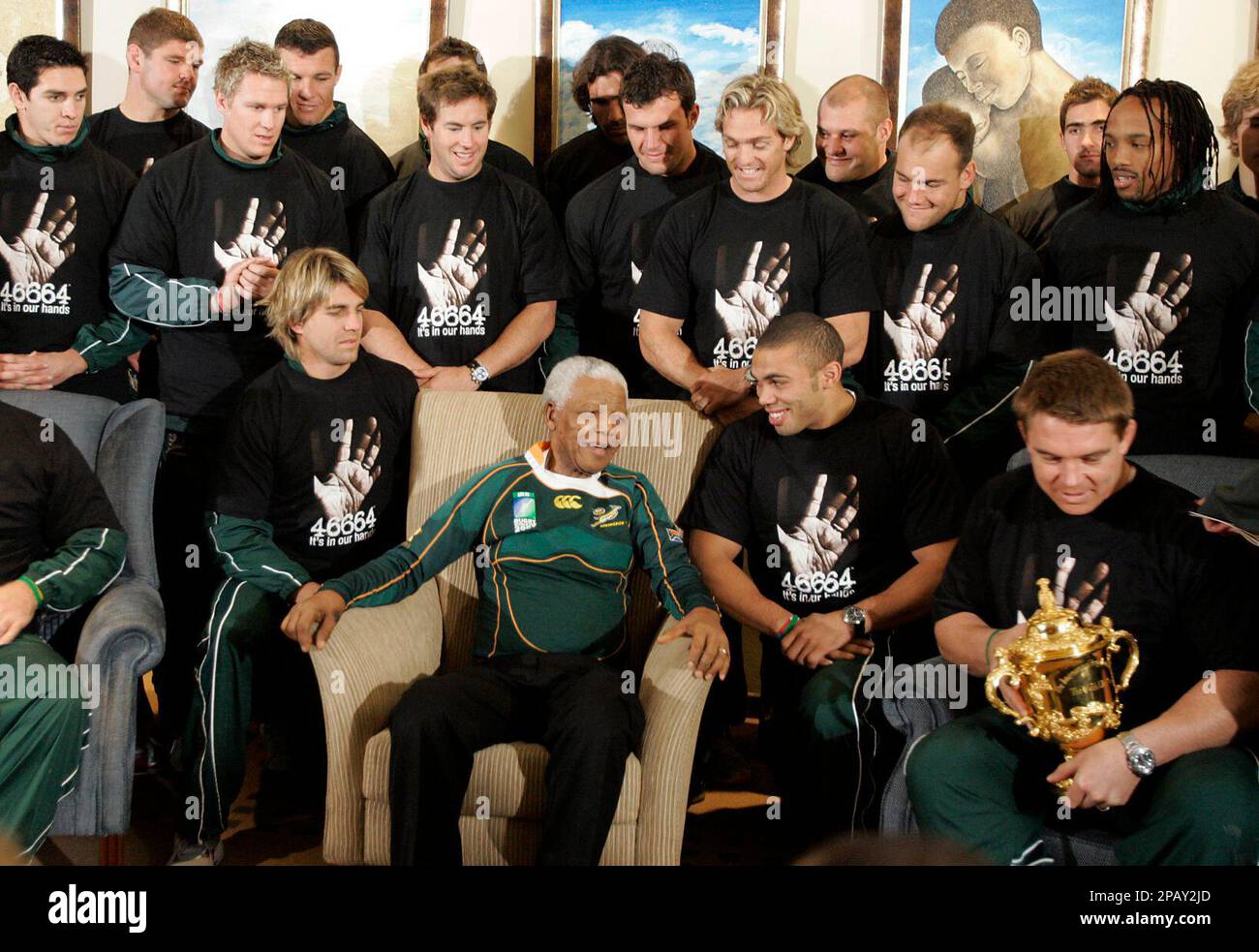 Former South African President Nelson Mandela sits at centre with the ...