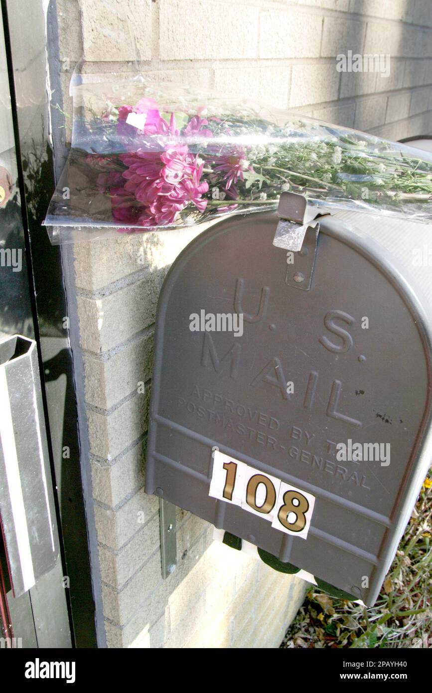 Flowers rest on the mailbox of the New Life Assembly of God church on ...