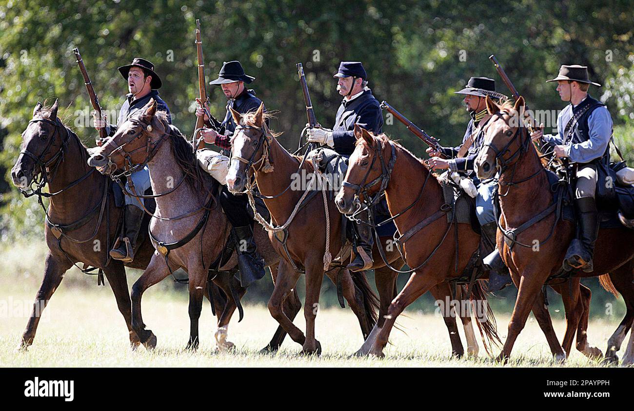 Re-enactors portraying Union Army cavalry in the 1863 period advance on ...