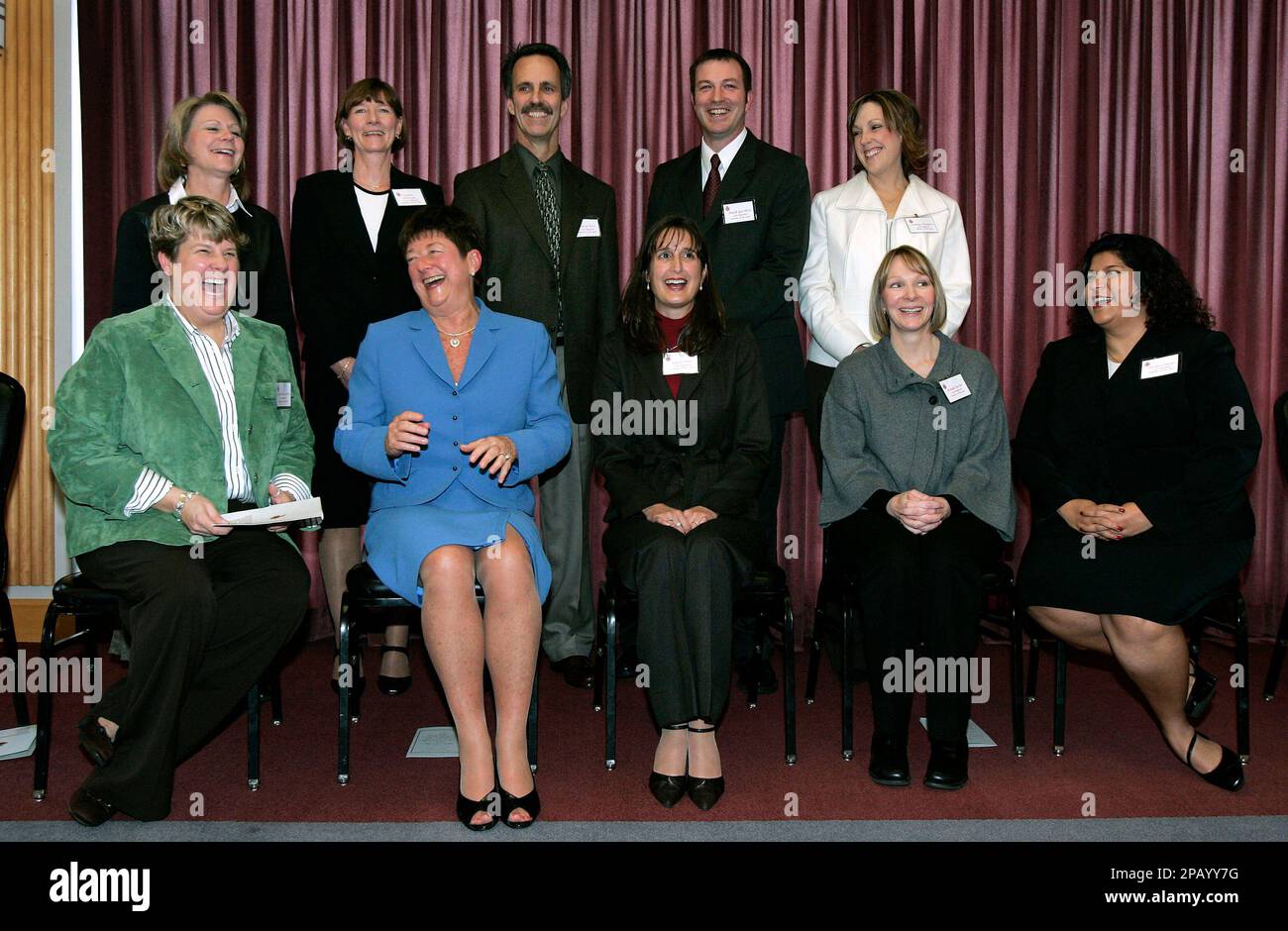 Superintendent of Public Instruction Terry Bergeson, seated second left ...