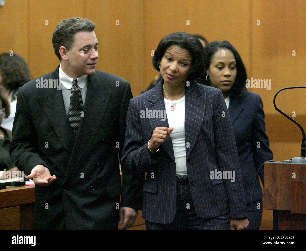 Prosecution team members, from left, Brett Pinion, Michele McCutcheon ...