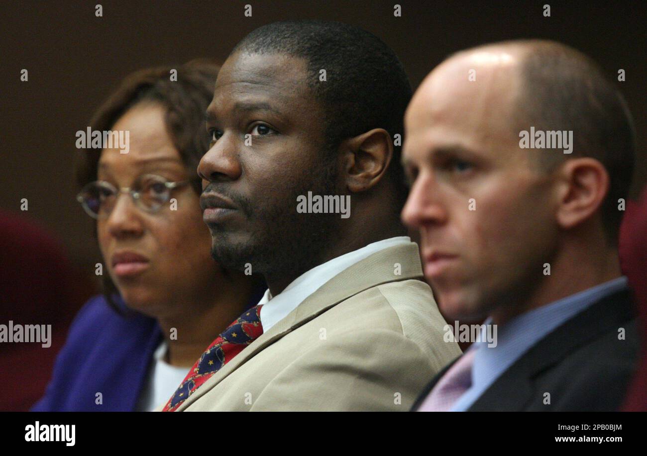 Defense team member Penelope Marshall, left; defendant Brian Nichols ...