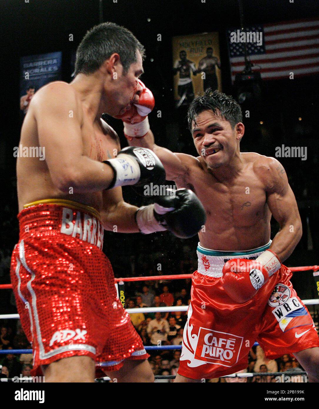 Boxer Manny Pacquiao, right, of the Philippines, lands a right to the face of Marco Antonio ...