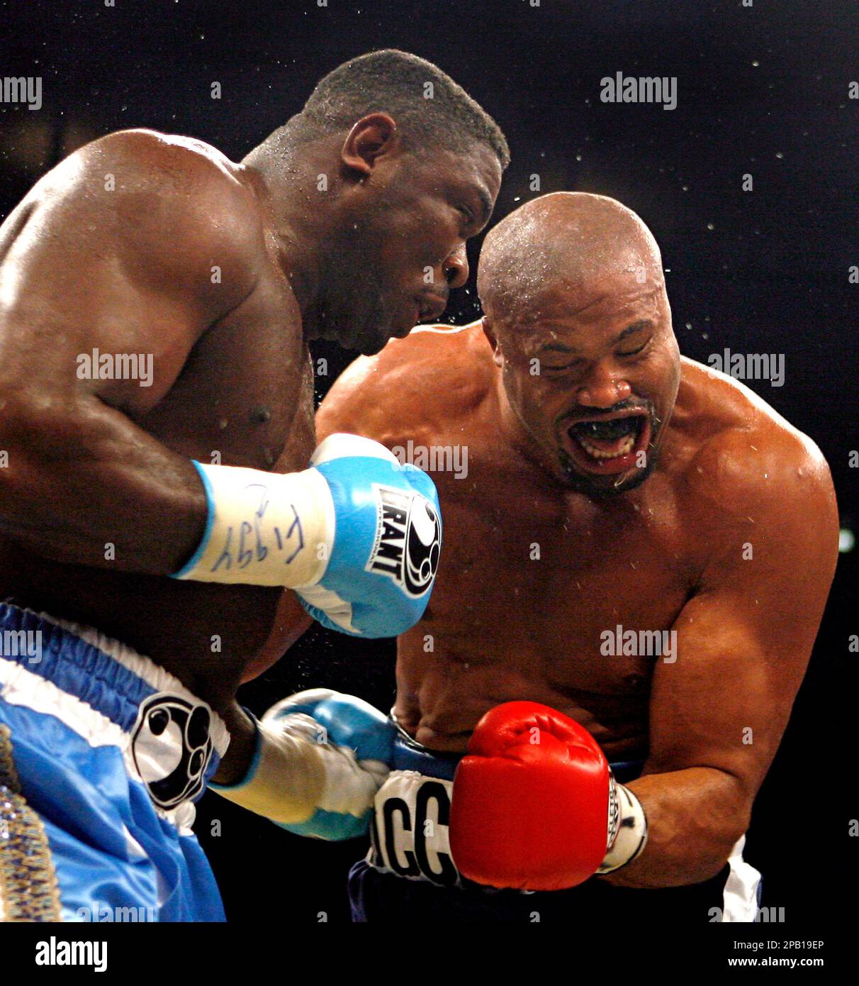 Nigeria's Samuel Peter, left, lands a punch against Jameel McCline ...
