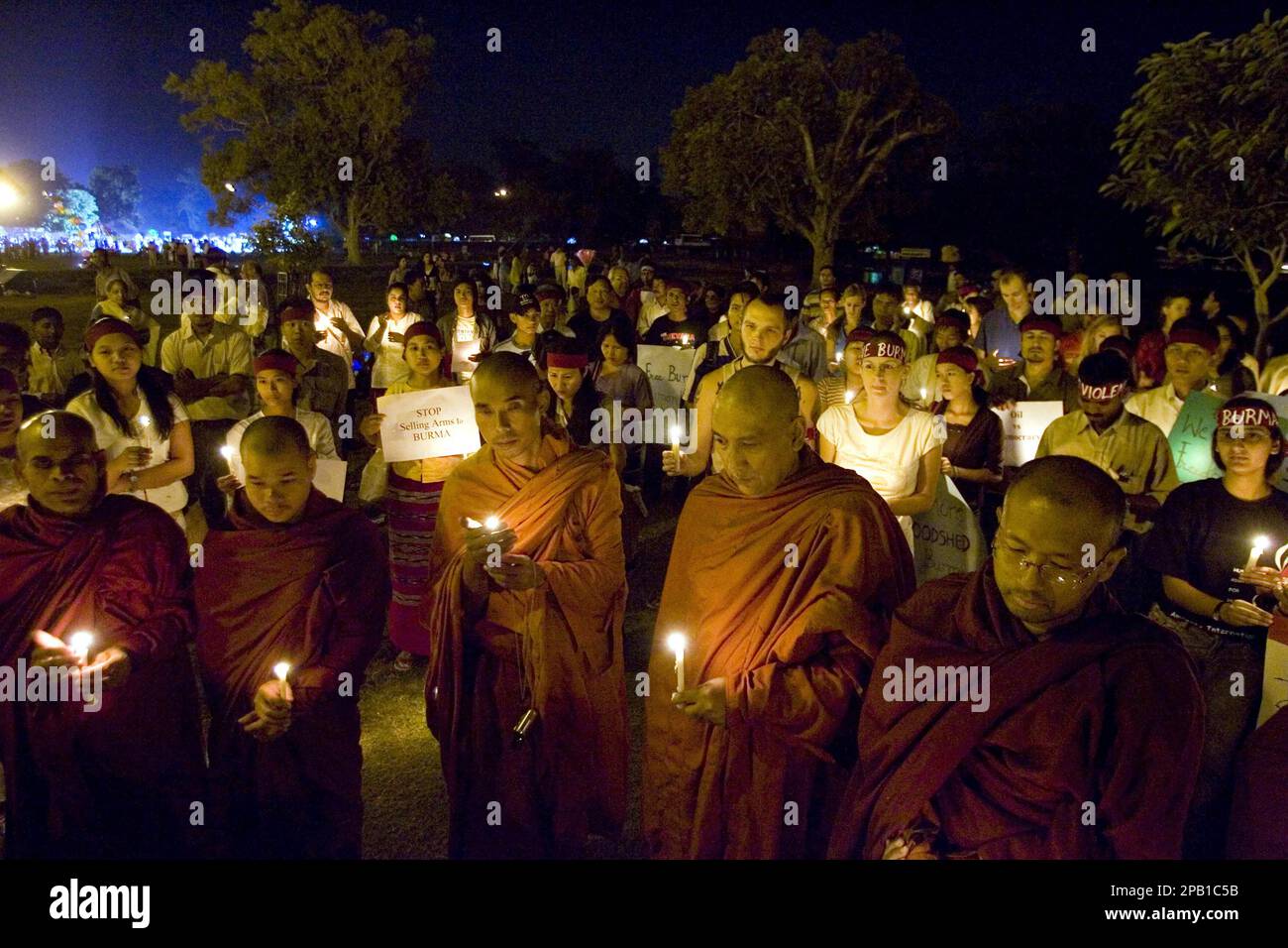 Buddhist monks and supporters for democracy in Myanmar hold a ...