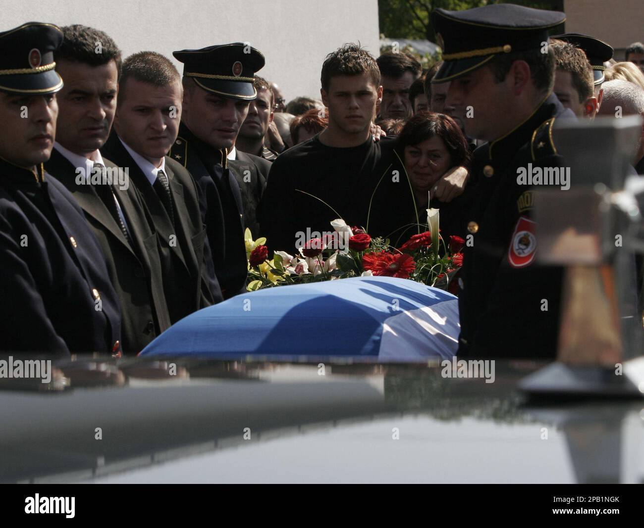 Petar Jelic and Milica Jelic, center rear, the son and wife of Milan ...