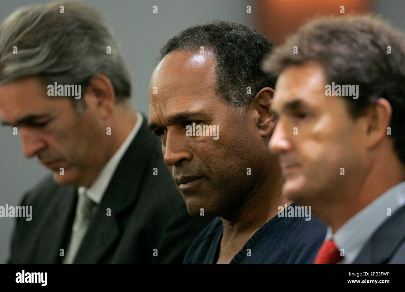 O.J. Simpson, center, is flanked by his lawyers Yale Galanter, right ...