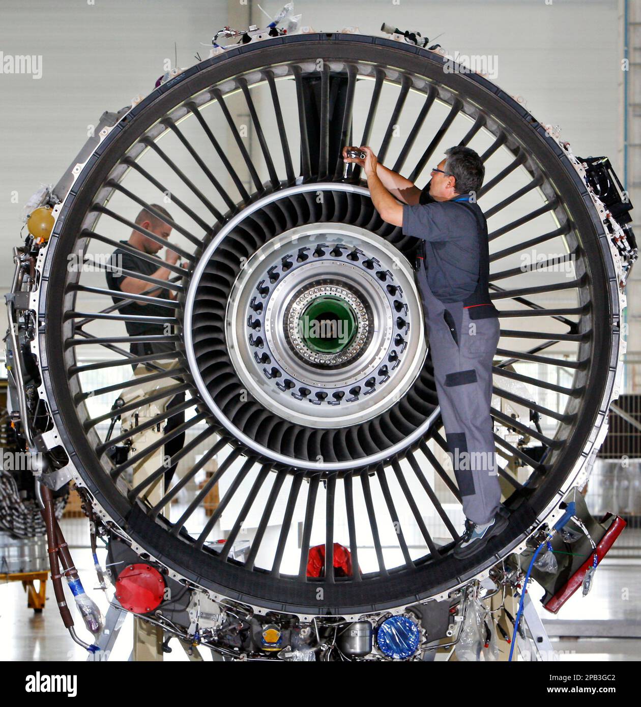 Jet engine mechanics Kay Truemmer, left, and Tobias Zimmermann, right ...