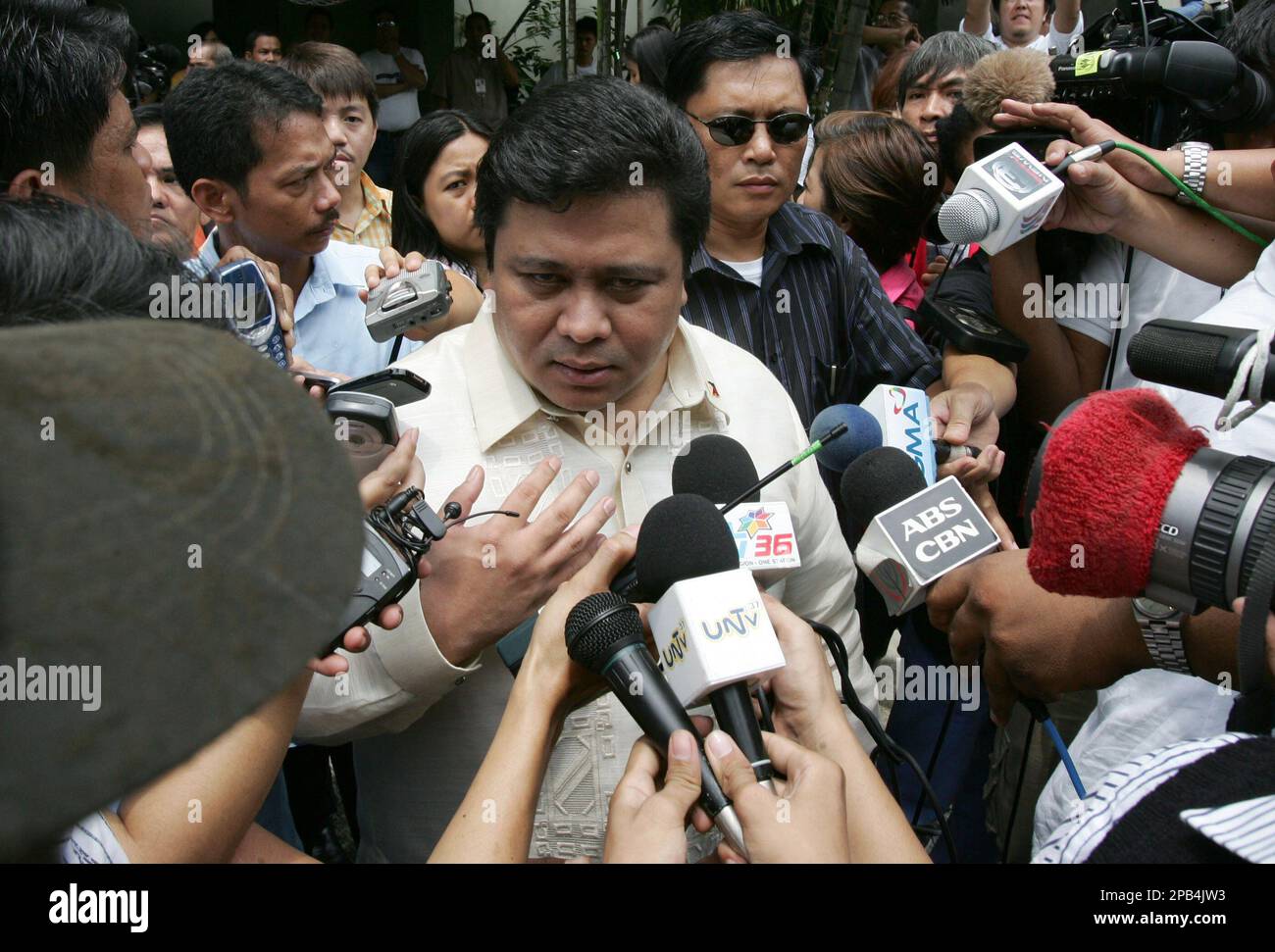 Philippine Senator Jinggoy Estrada, center, the son and co-accused of ...