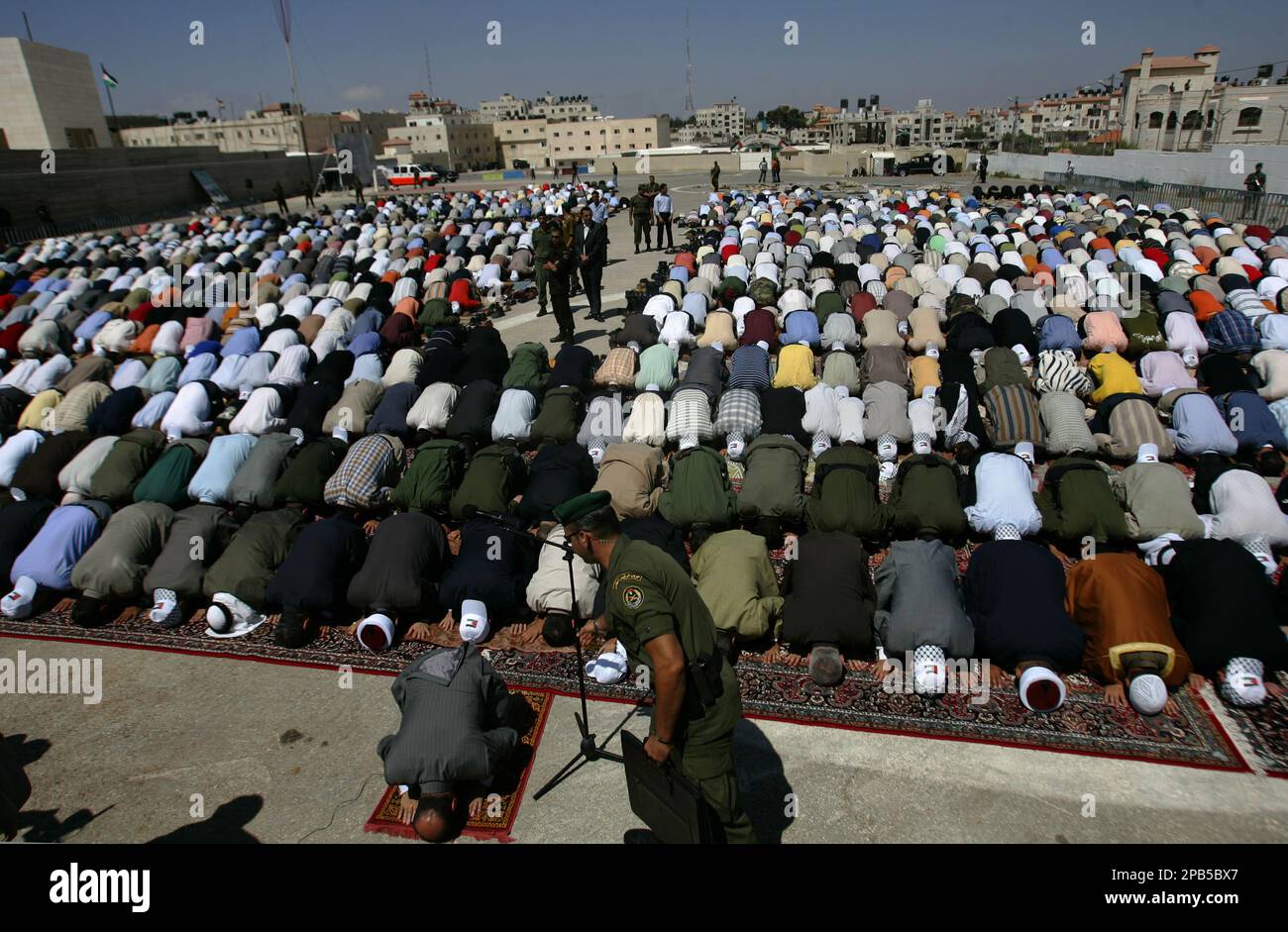 Palestinians pray outside at the office of President Mahmoud Abbas ...