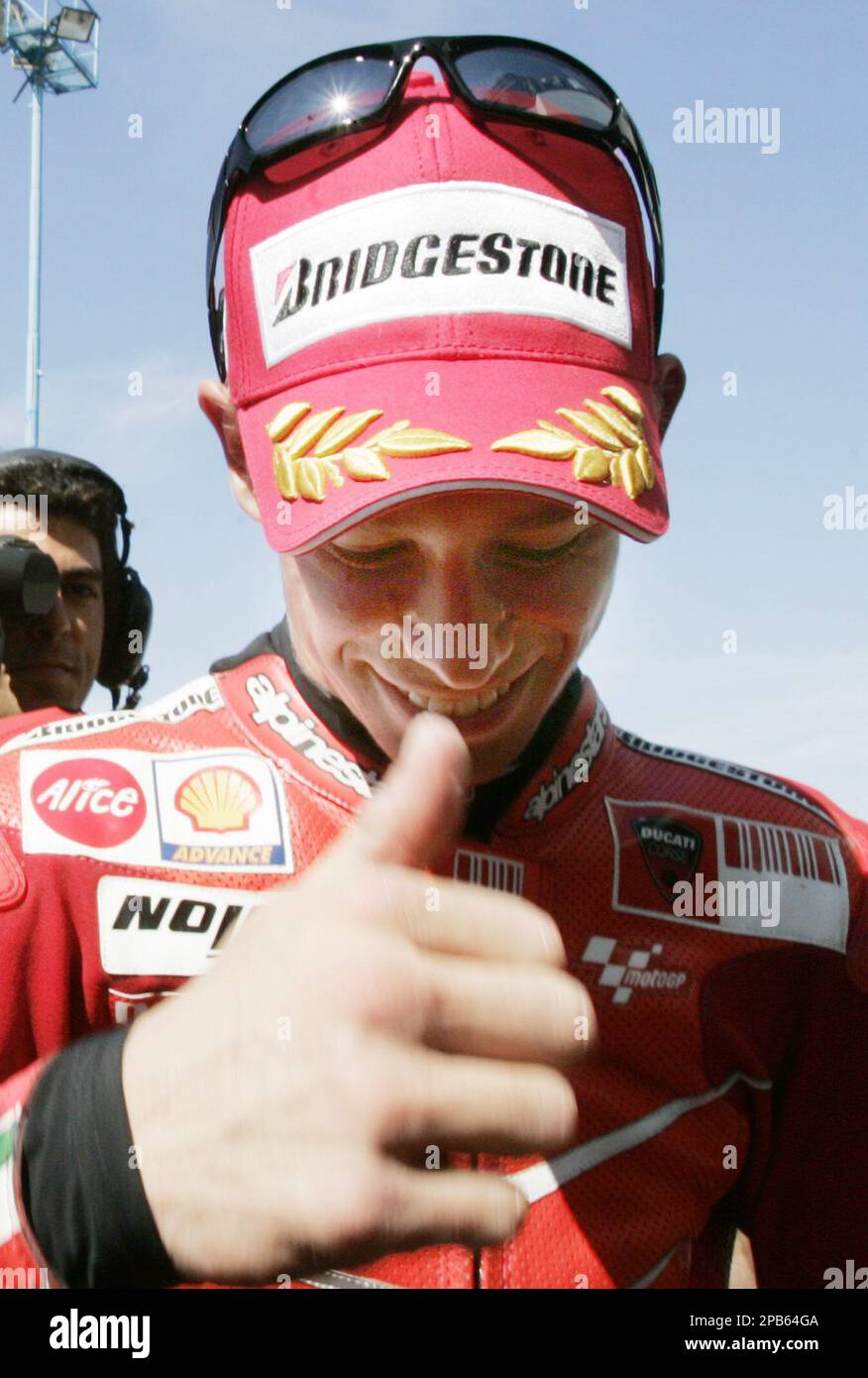 Australia's Ducati rider Casey Stoner thumbs up as he wins the San ...
