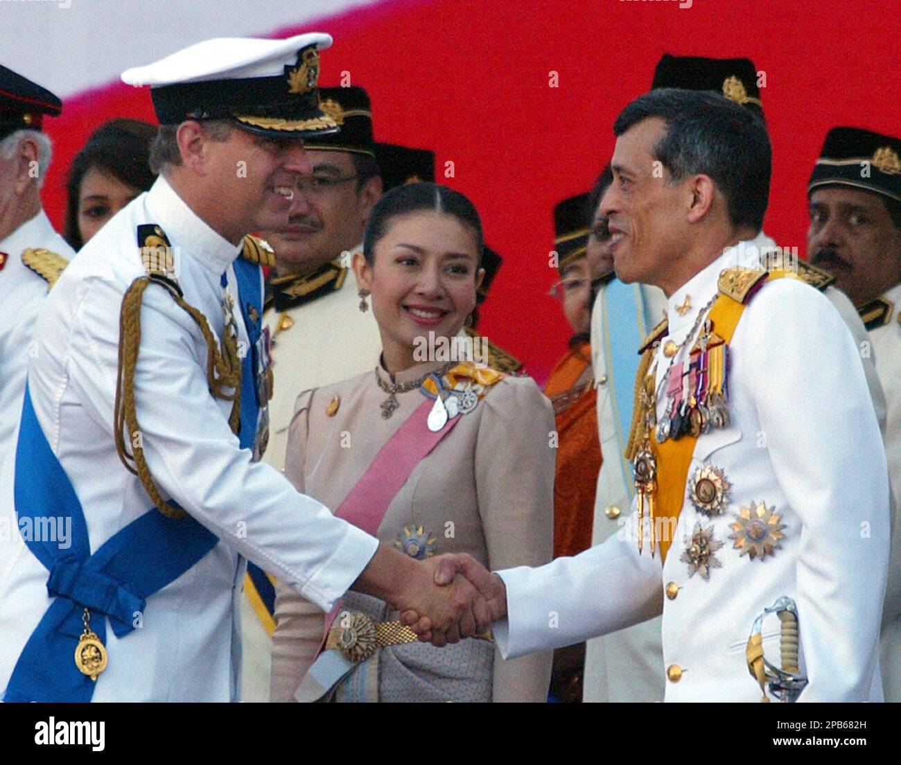 British Prince Andrew, left, shakes hands with Thailand's Crown Prince ...