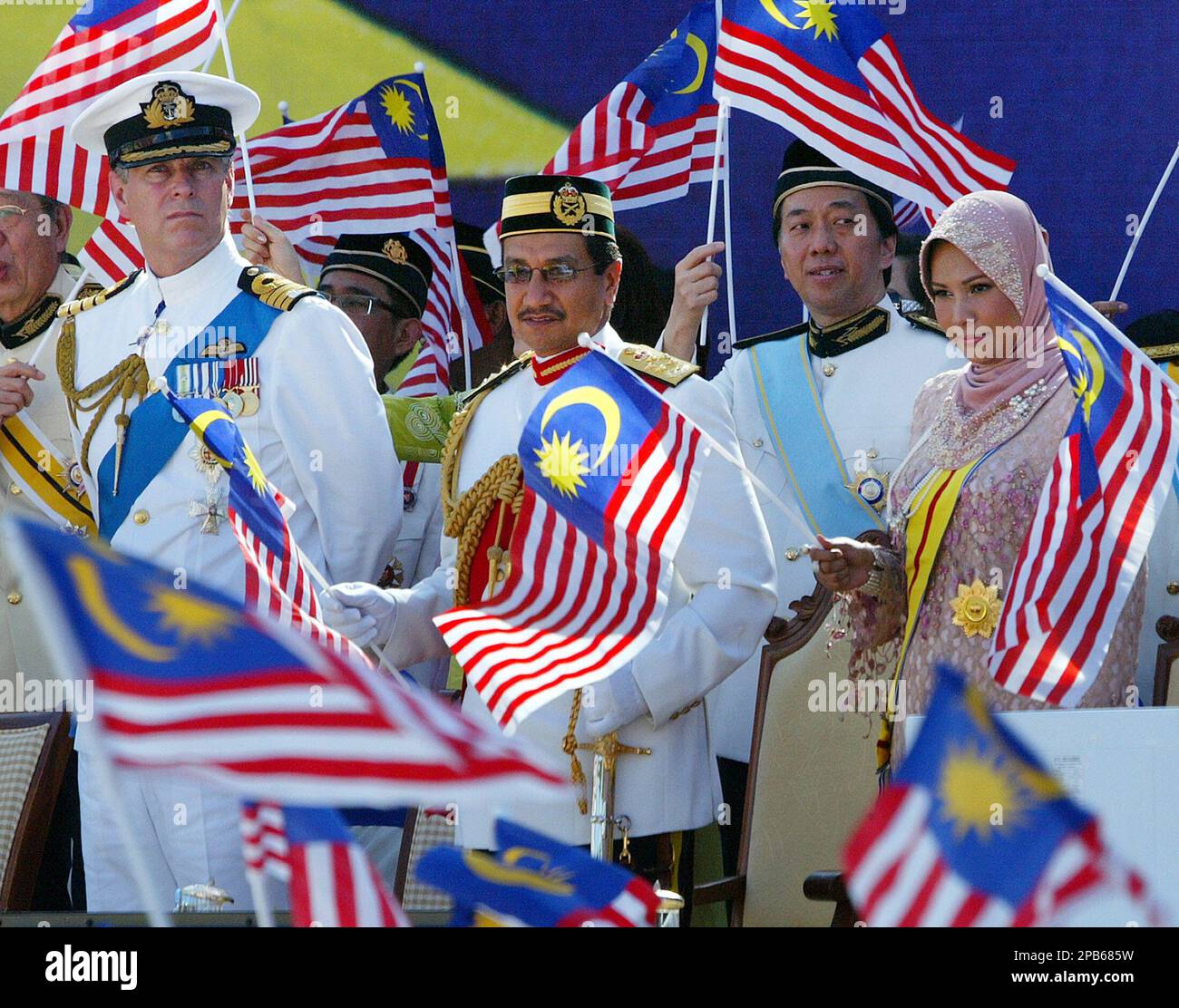 Malaysia's King Sultan Mizan Zainal Abidin, center, and his wife Queen ...