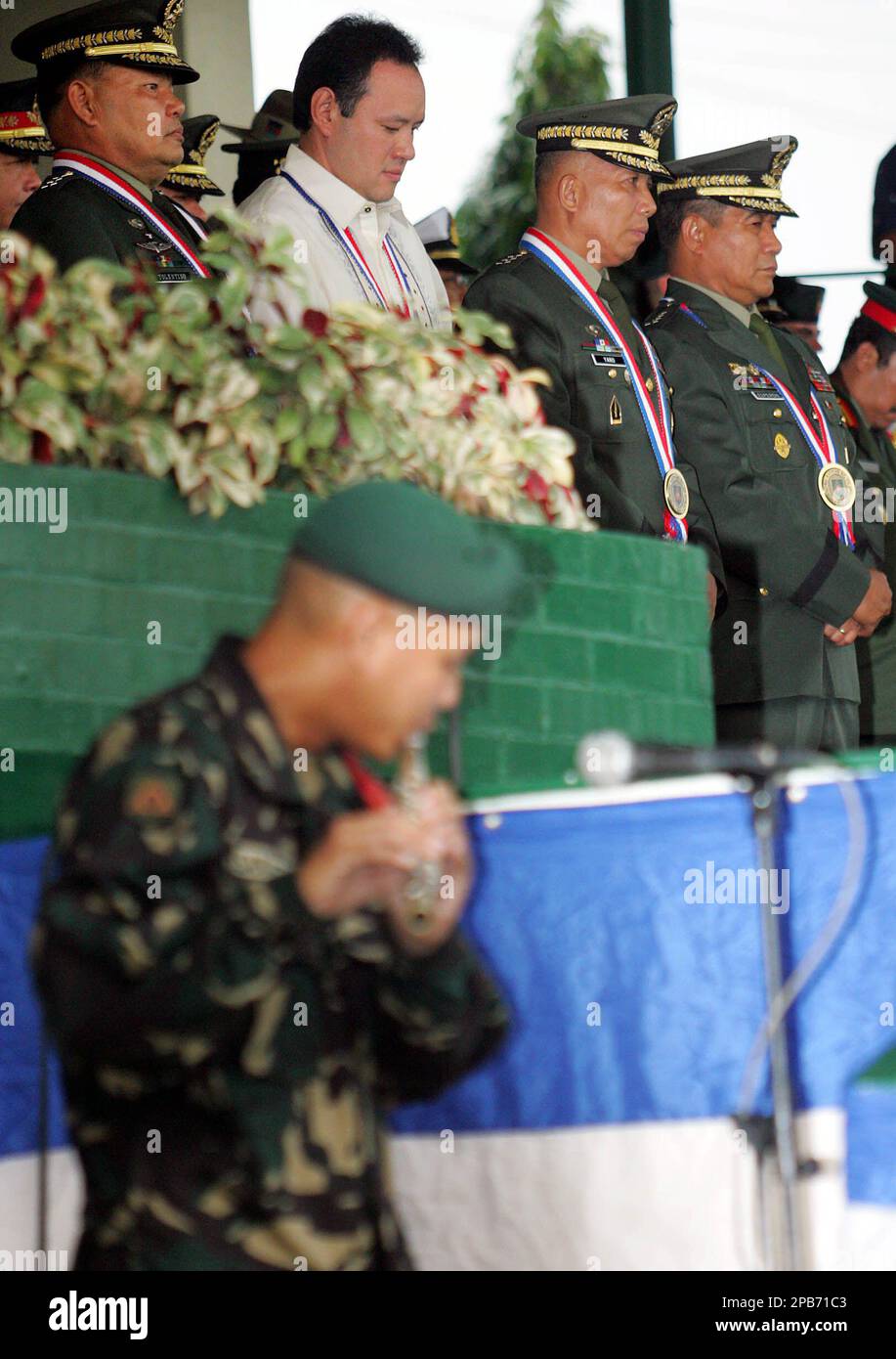 Outgoing Philippine Army Chief Lt. Gen. Romeo Tolentino, left, National ...
