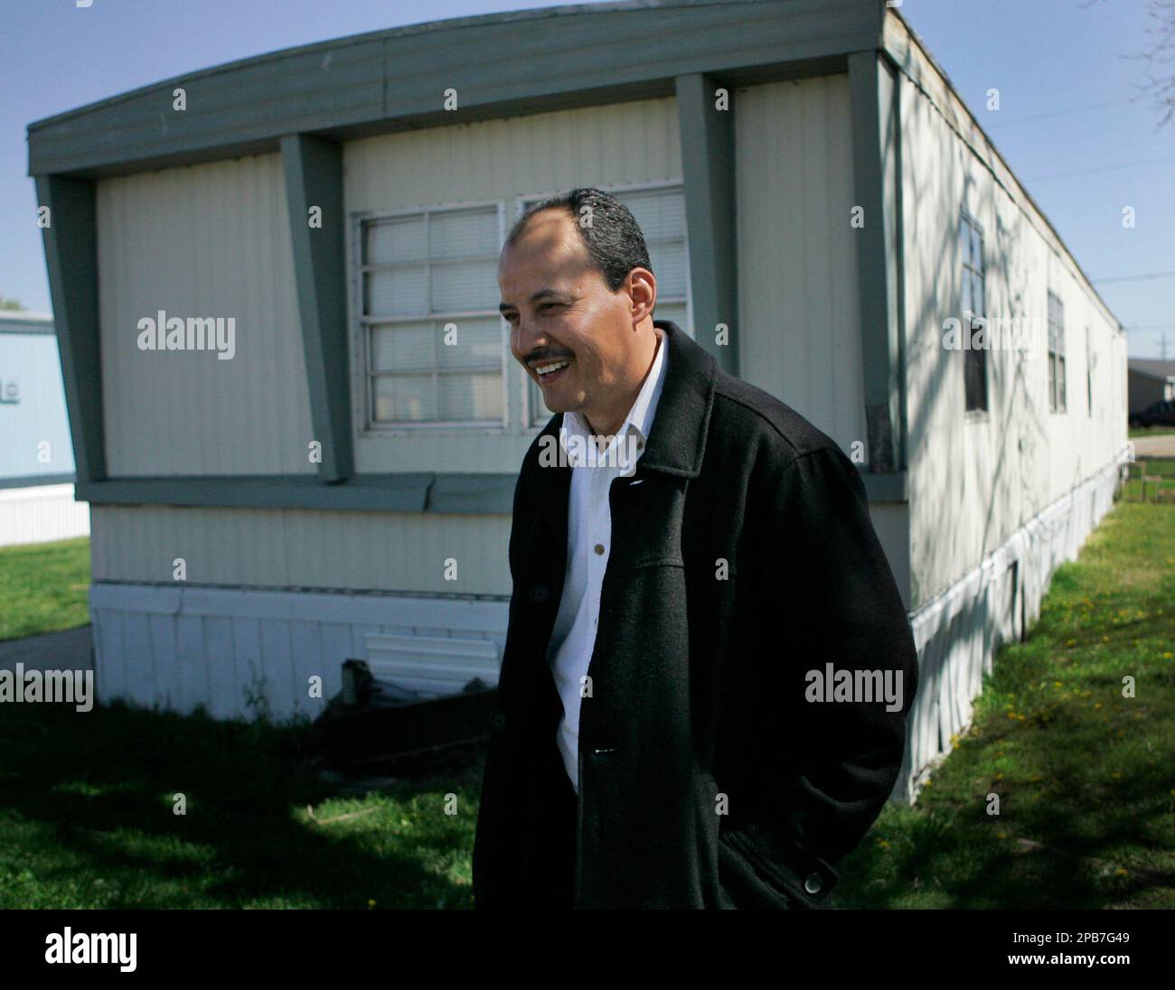 Arturo Ponce stands outside the trailer home in Dodge City, Kan., April ...