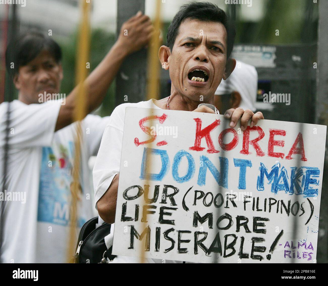 A Filipino man shouts slogans during a rally outside the South Korean ...