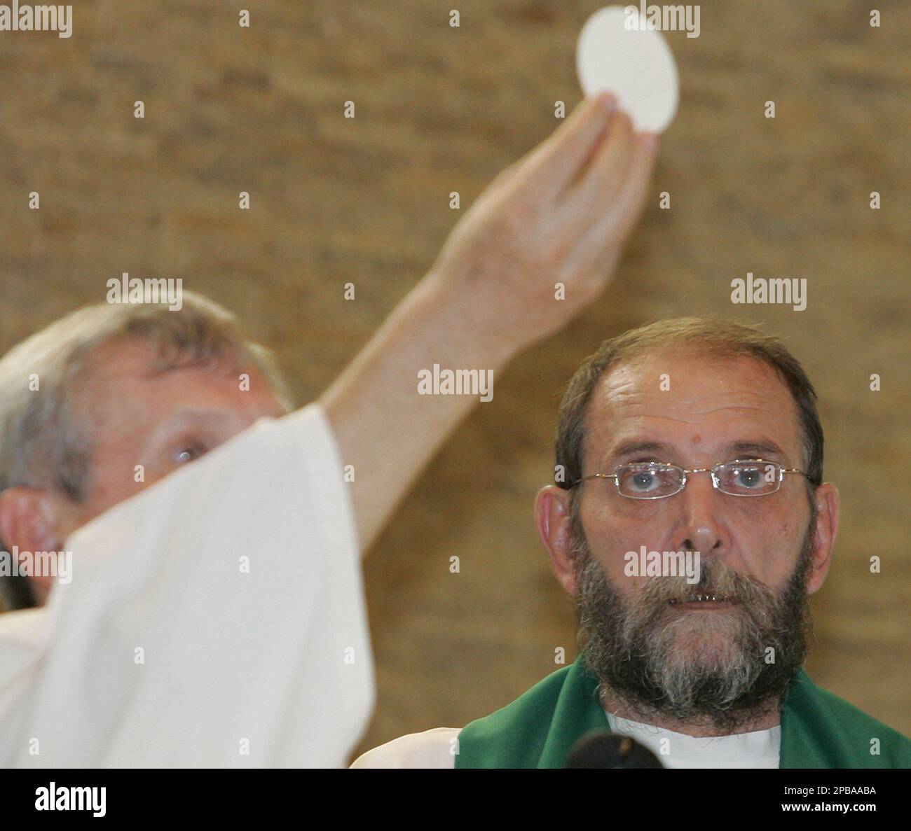 Freed Italian Priest Giancarlo Bossi, right, looks on during offertory ...