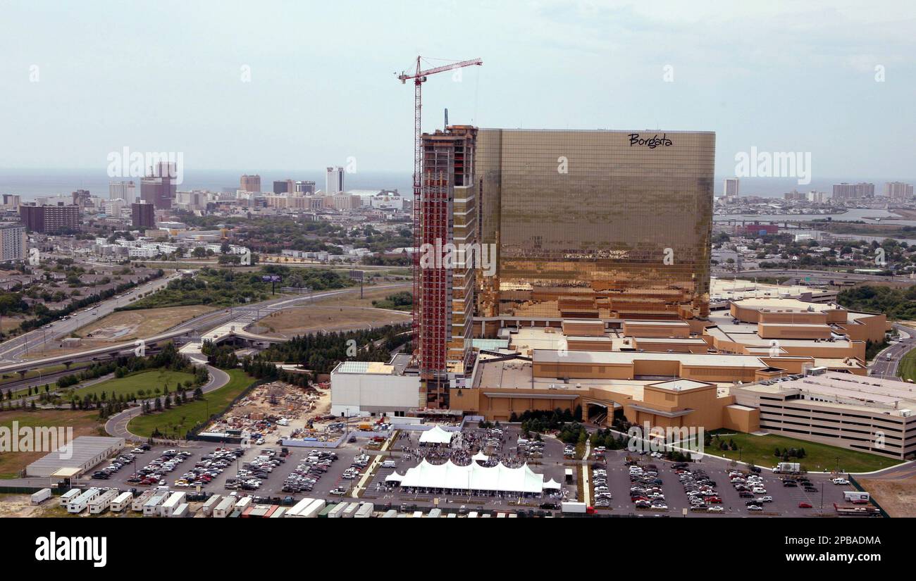 The last piece of vertical steel is raised into place atop the new ...