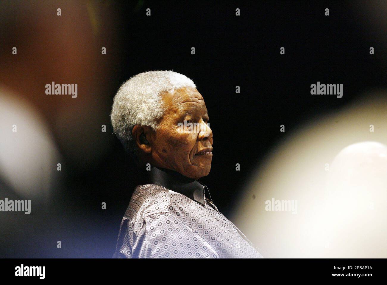 Former South African President Nelson Mandela listens as South African ...