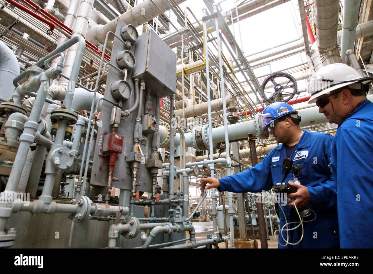 Richard Juarez, left, and Doug Wright, right, take a pressure reading ...