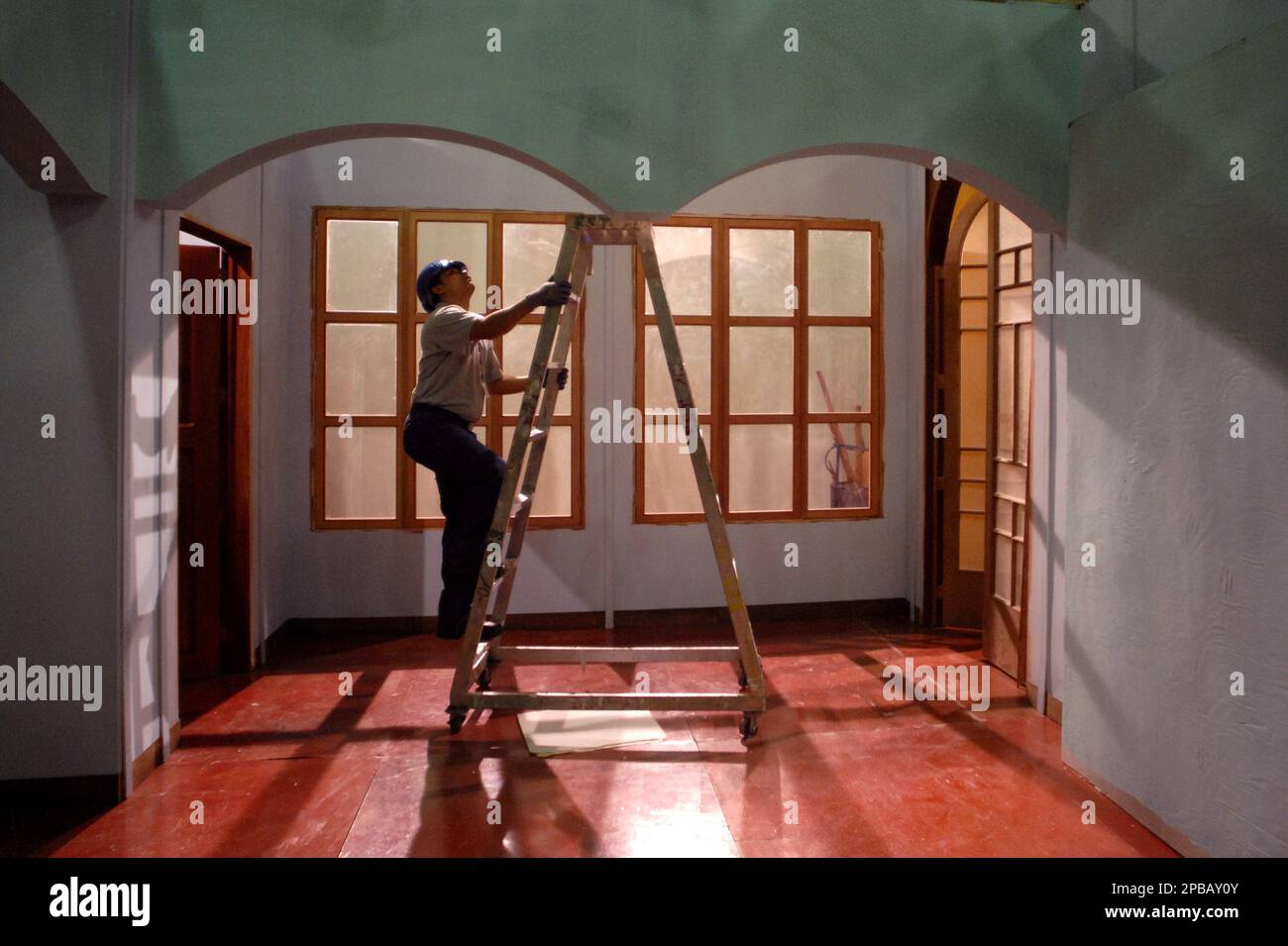 A worker prepares a soap opera set in Radio Caracas Television's, RCTV ...