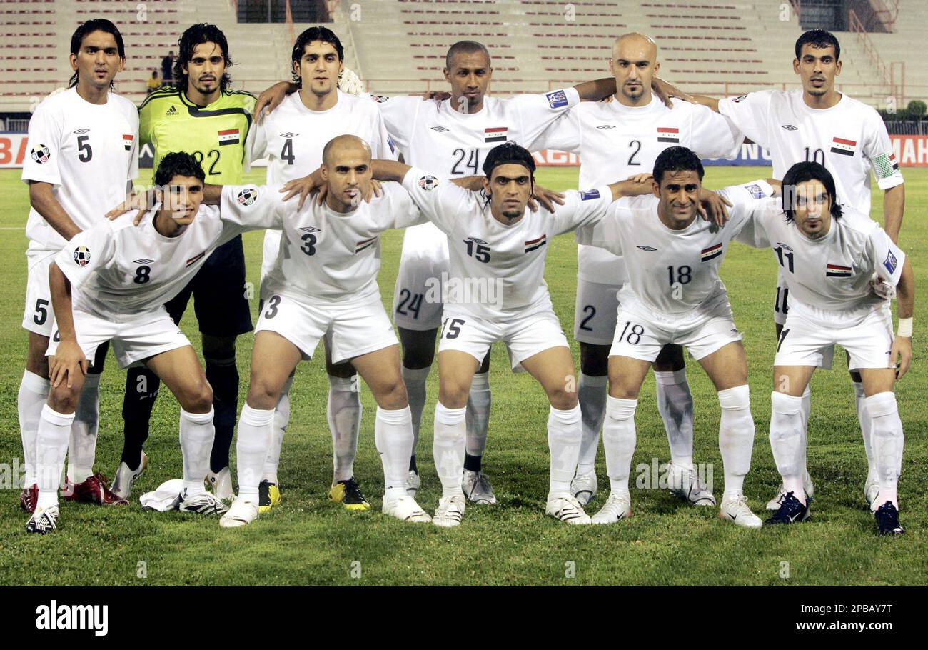 Iraq's soccer players pose for a group photograph prior to a group-A ...