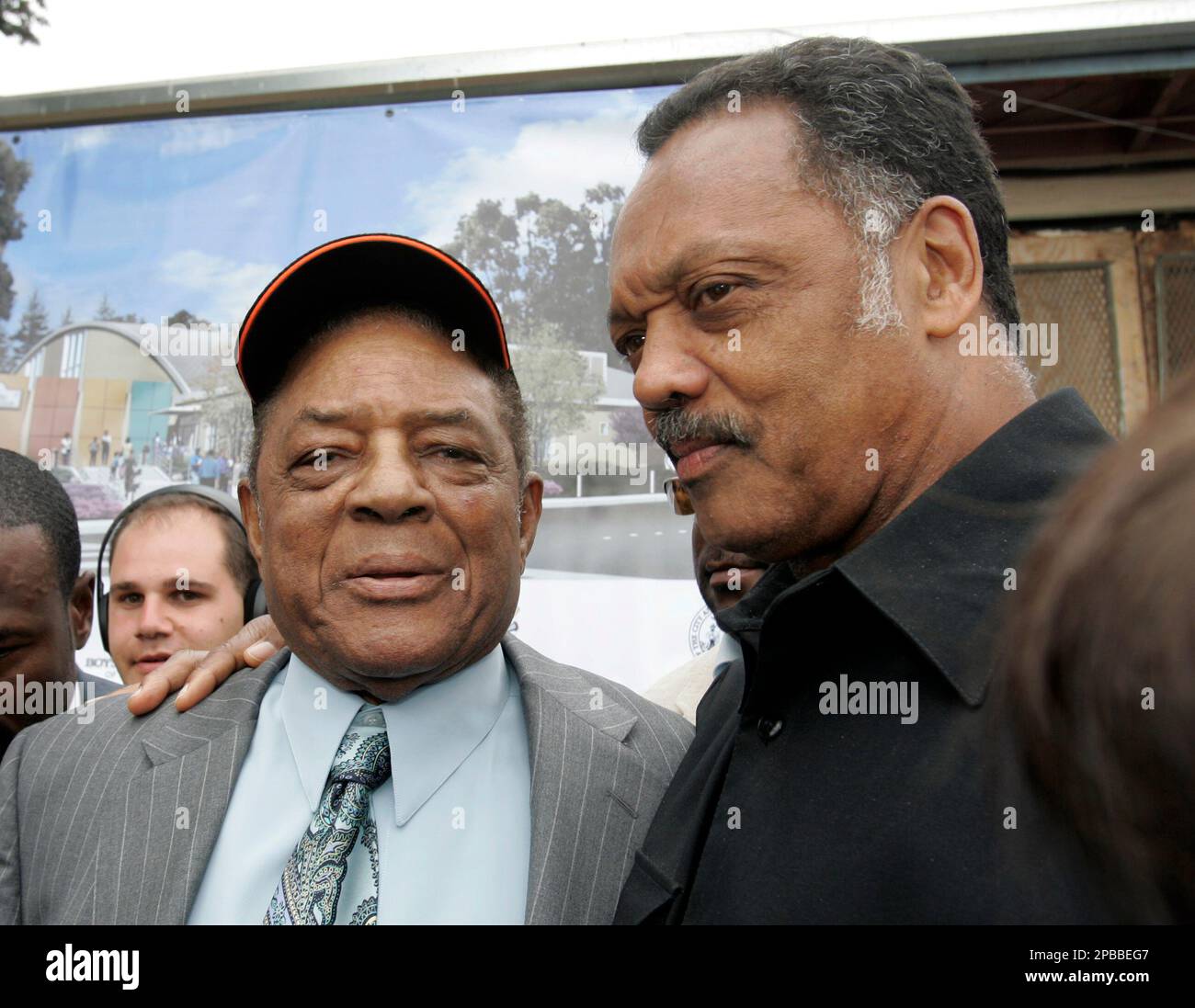 San Francisco Giants Hall of Famer Willie Mays, left, is hugged by Rev ...