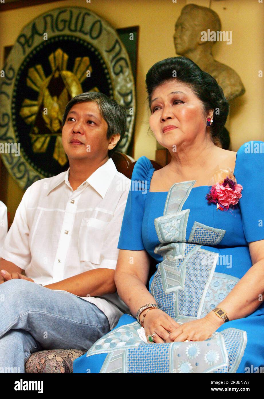 Former first lady Imelda Marcos, right, sits beside her son Ferdinand ...