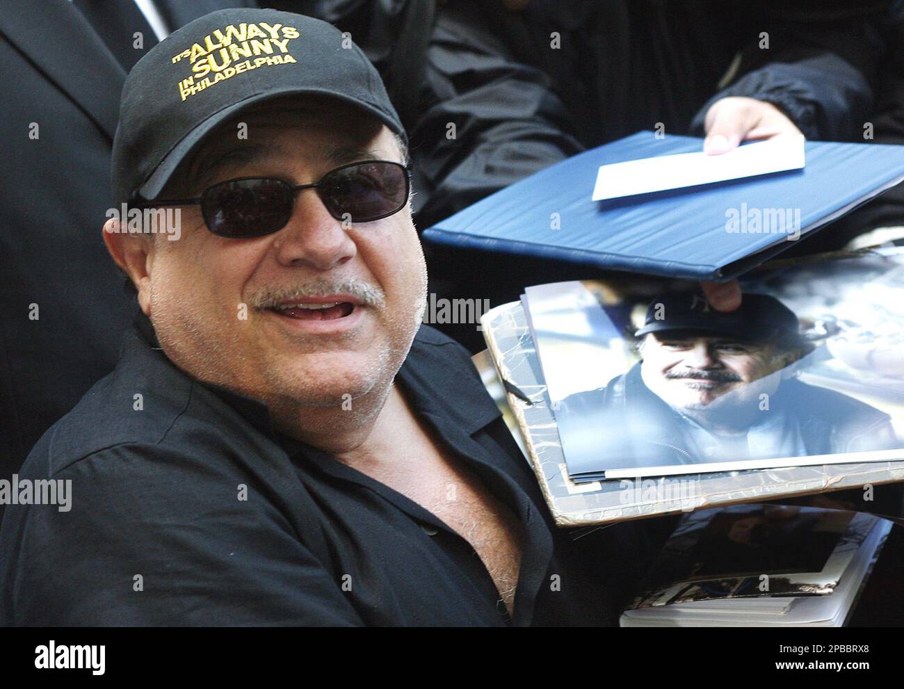 U.S. actor Danny DeVito smiles while being mobbed by fans seeking to ...