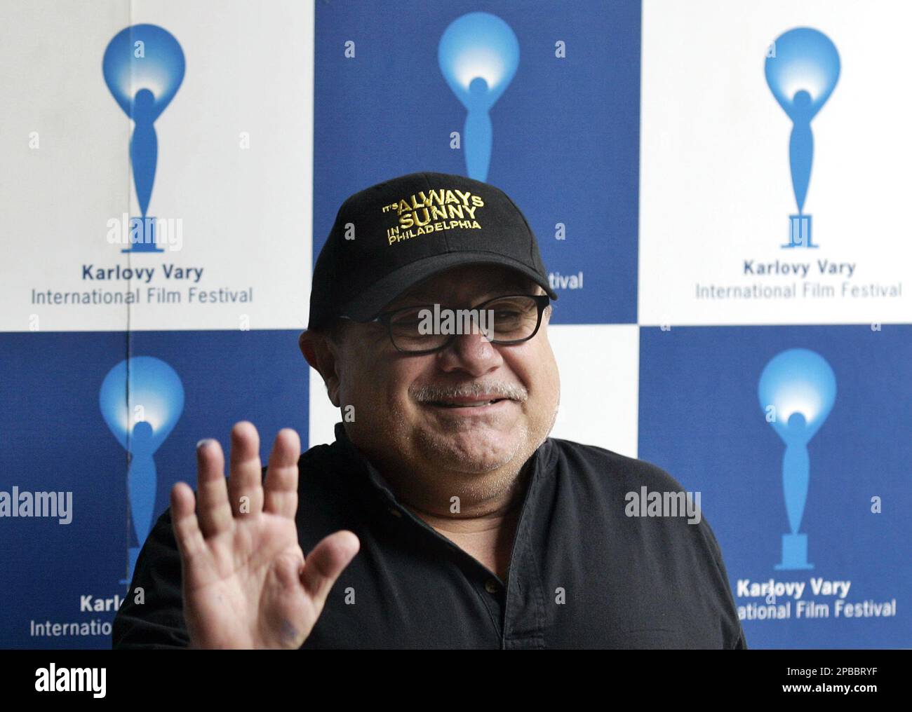 U.S. actor Danny DeVito waves as he poses for photographers upon his ...