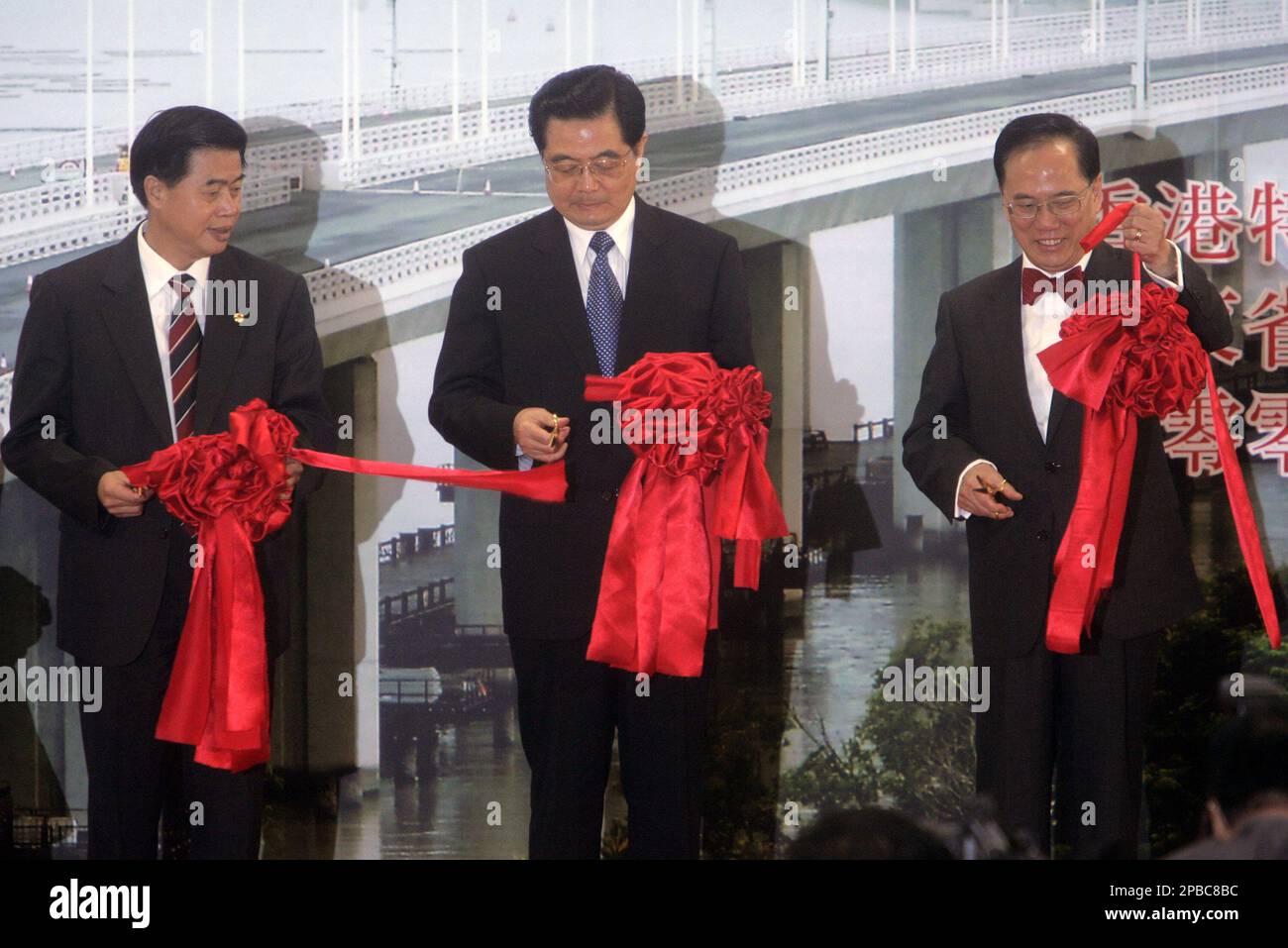 From left to right, Governor of China's Guangdong Province Huang Huahua ...