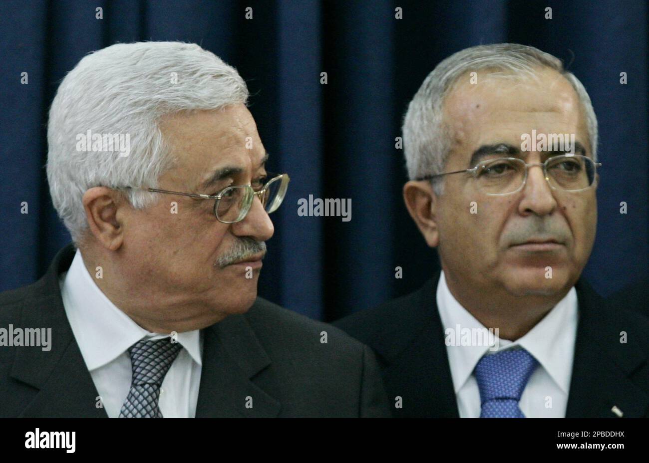 Newly-appointed Palestinian Prime Minister Salam Fayad, right, stands ...