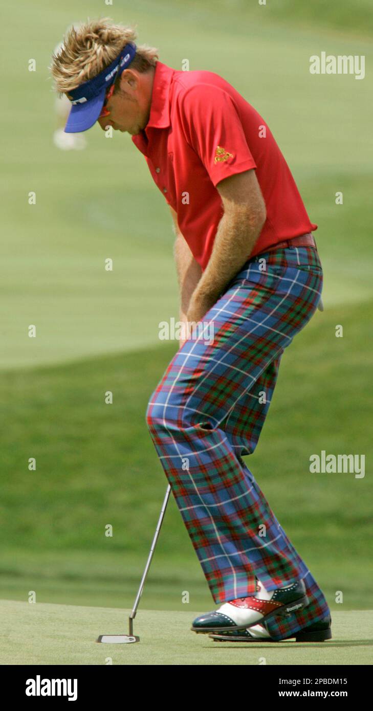 Ian Poulter of England reacts after missing a putt for par on the 18th ...