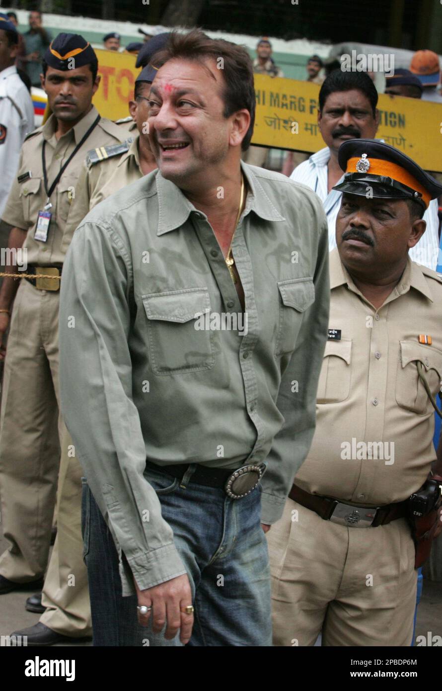 Bollywood actor Sanjay Dutt smiles as he arrives at a special court ...