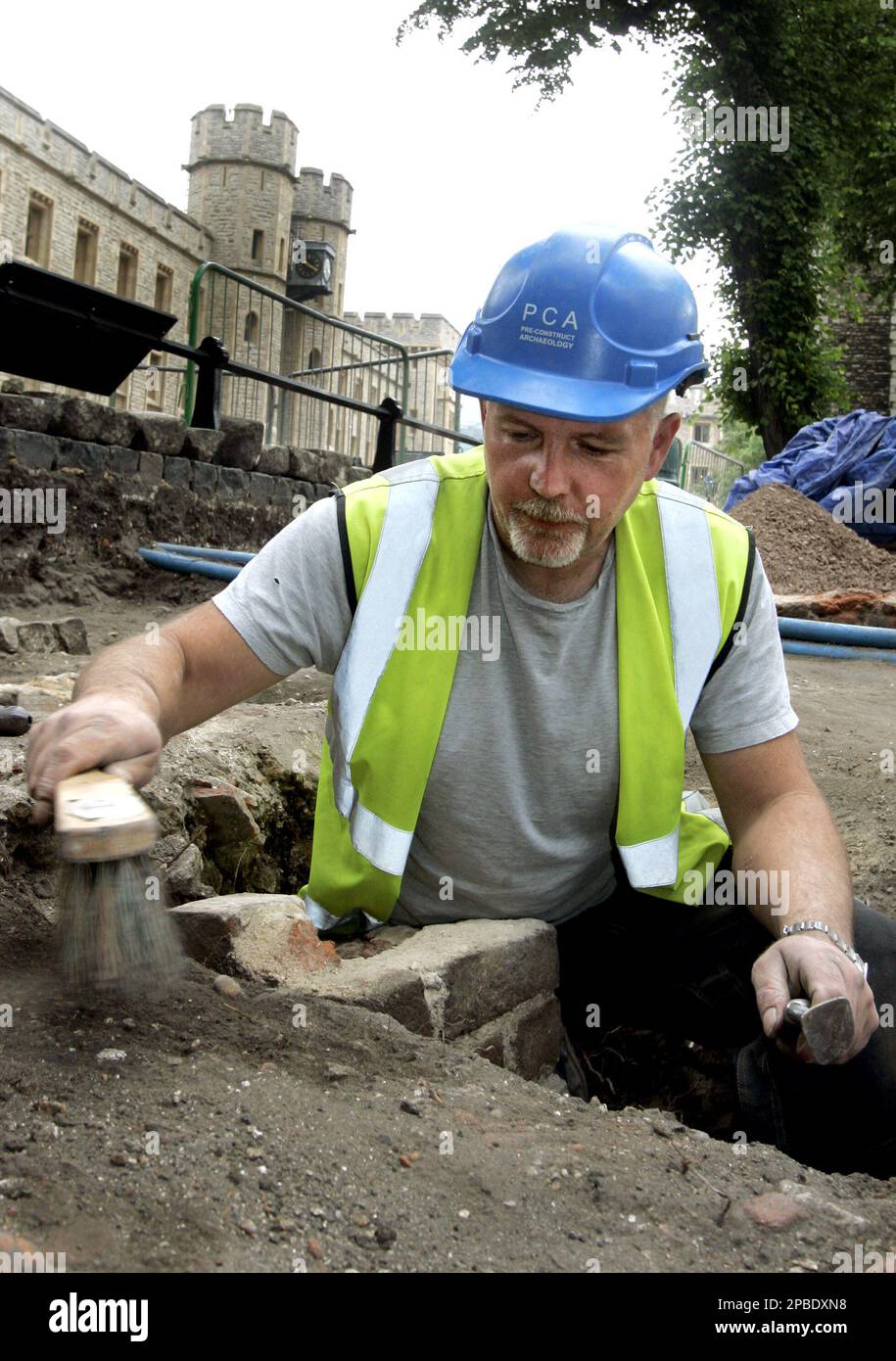 Archaeologist Stuart Watson works on excavations in Tower Green at the ...