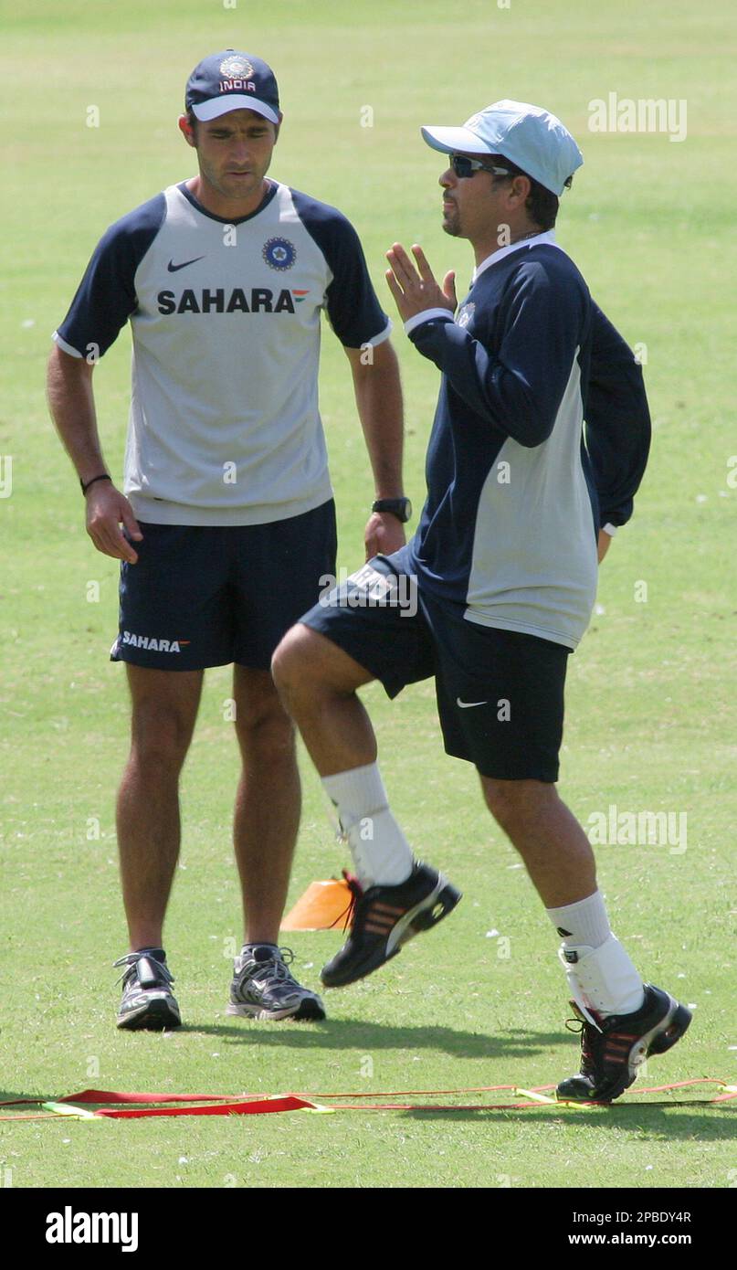 Indian cricketer Sachin Tendulkar, right, jogs as the team's physical ...