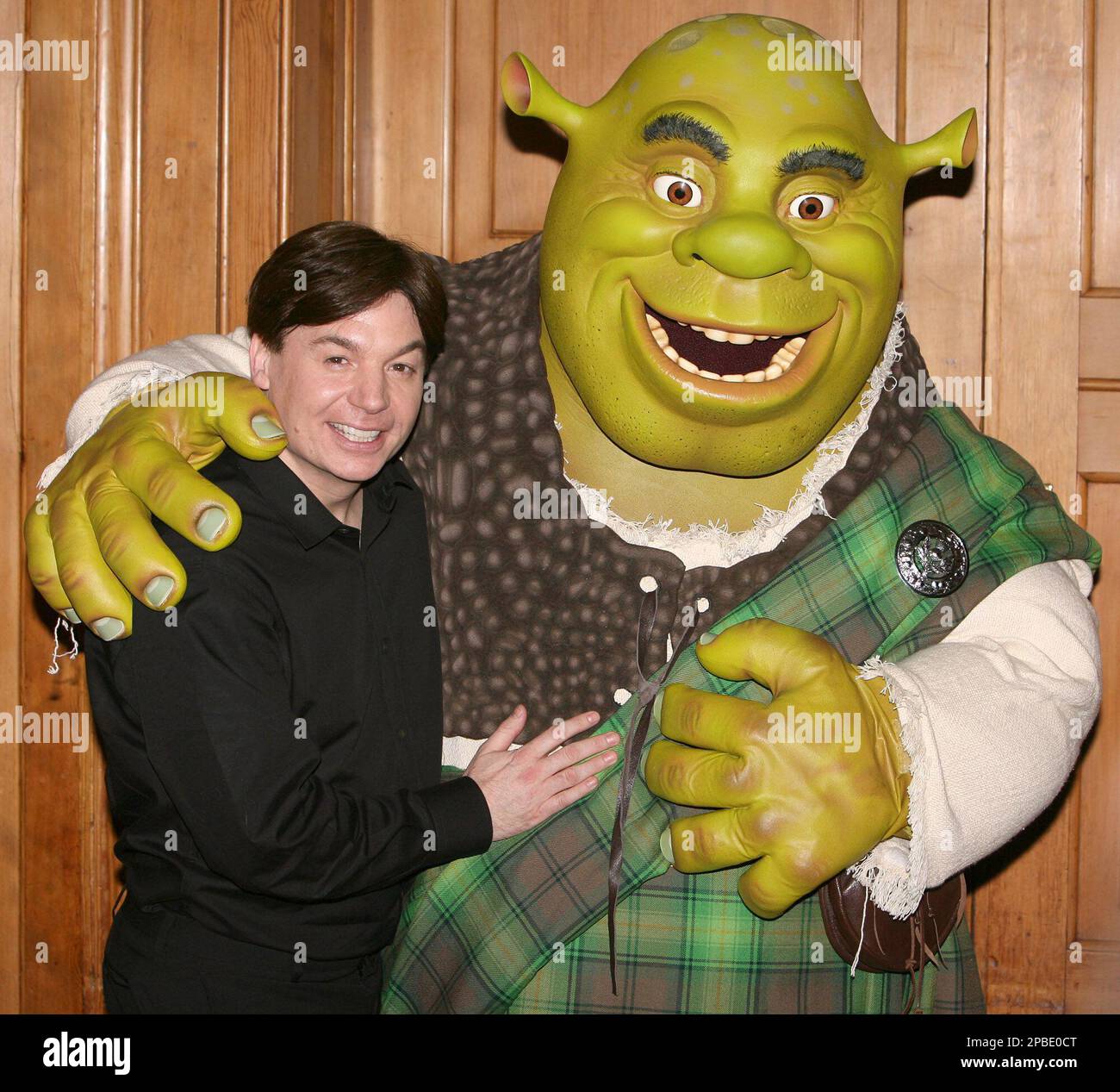 Canadian actor Mike Myers and the character Shrek pose during a "Visit ...