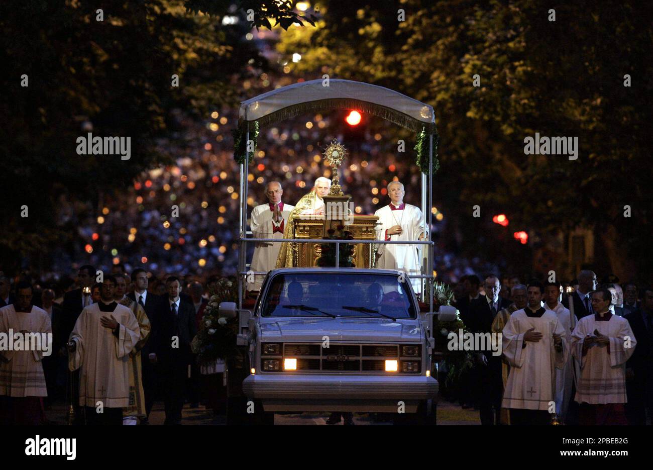 Pope Benedict XVI leads the Corpus Domini procession in an open van ...
