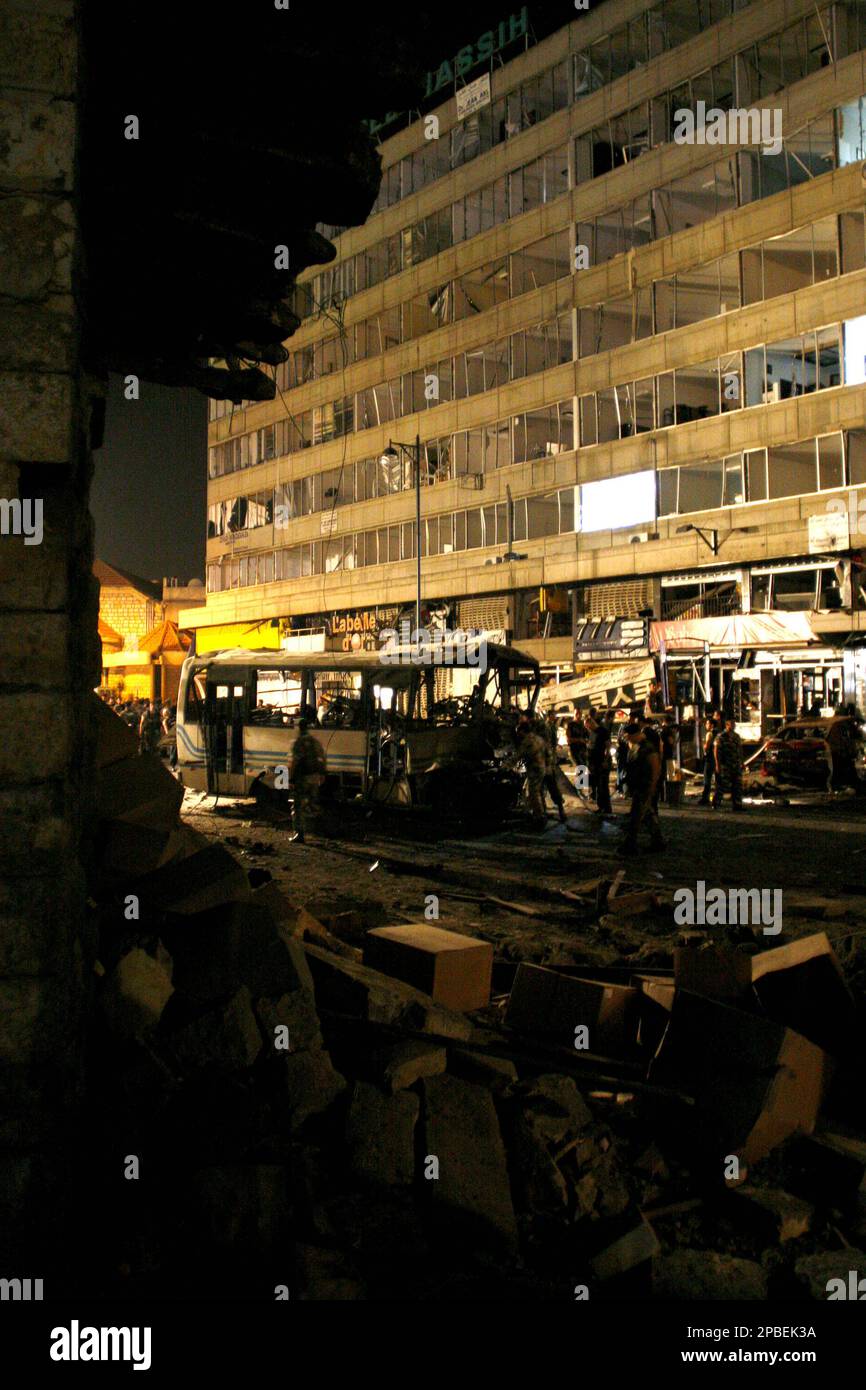 Lebanese soldiers secure the scene where a bomb exploded near an empty ...