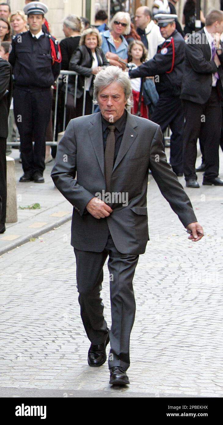 French actor Alain Delon leaves the Saint-Louis en l'Ile church after ...