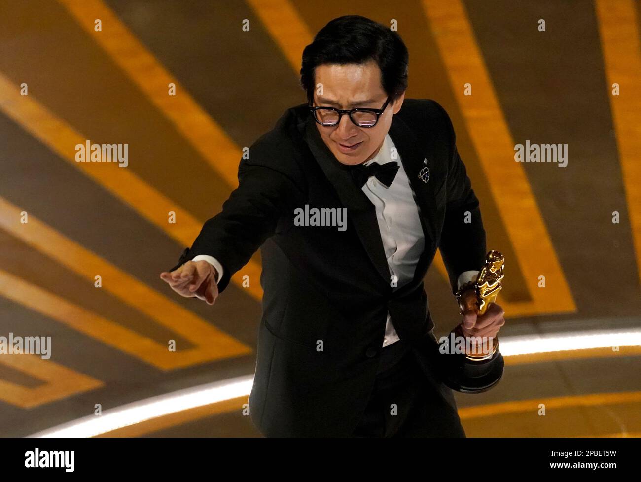 Ke Huy Quan accepts the award for best performance by an actor in a ...