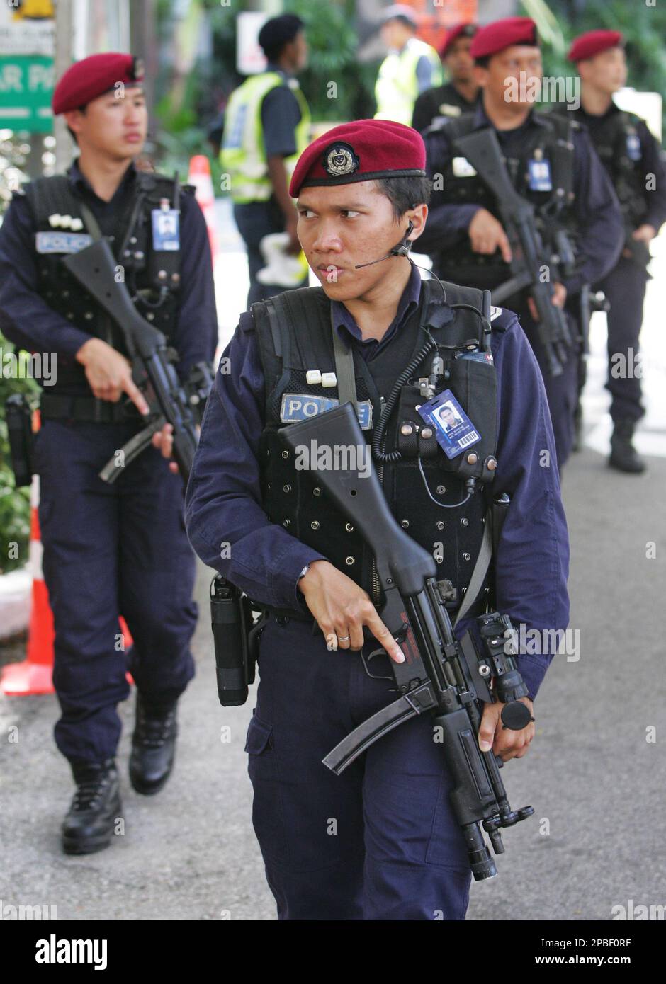 Singaporean police officers patrol Shangri-La Hotel where a security ...