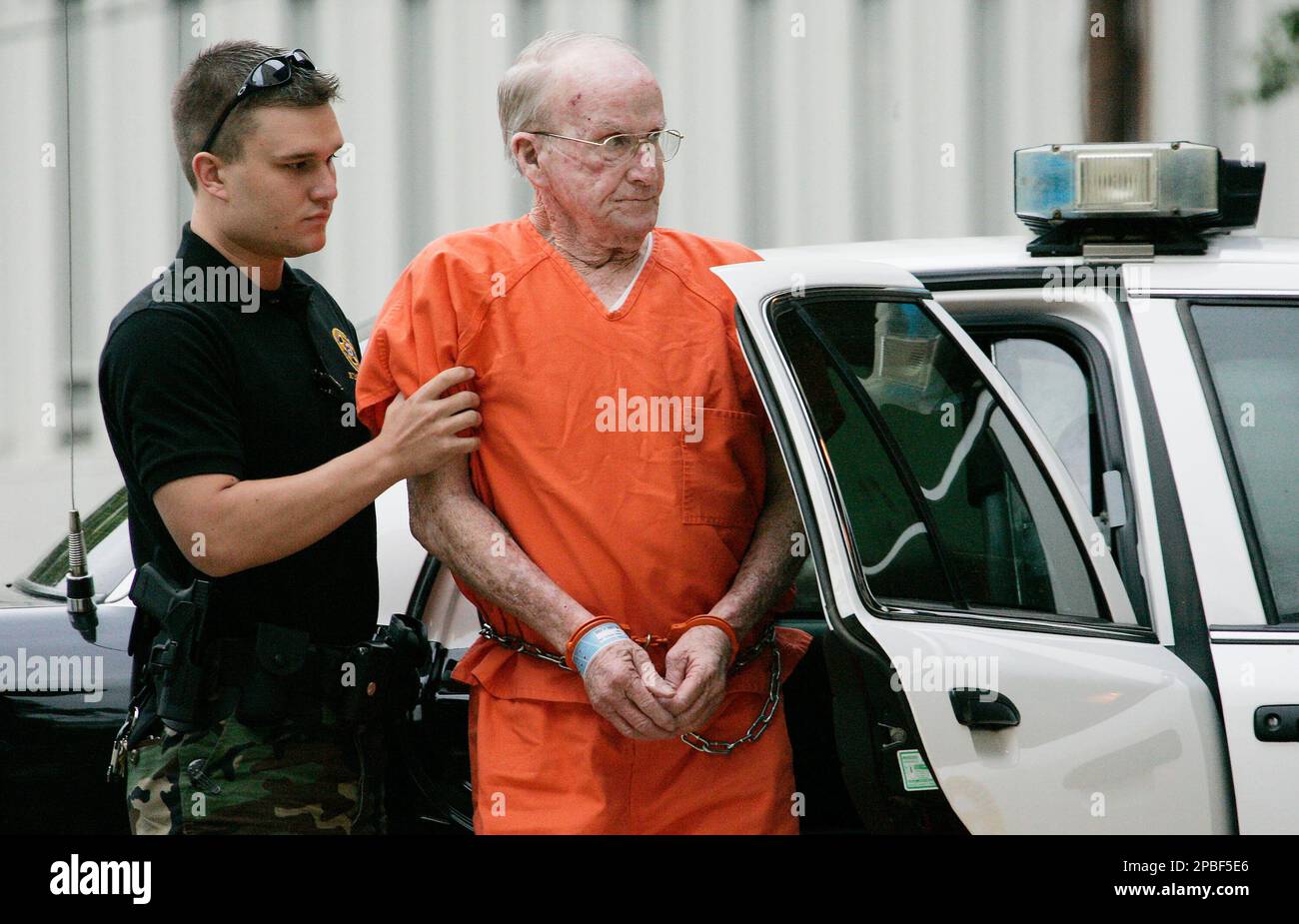 Reputed Ku Klux Klansman James Ford Seale, right, is escorted by a ...