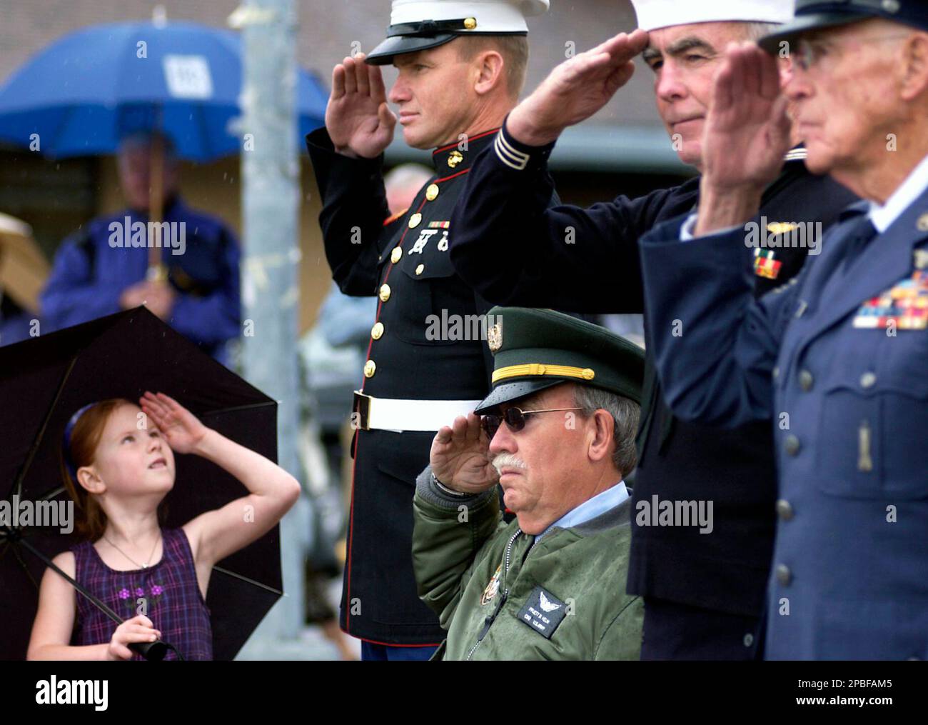 Six-year-old Allison Dennison of Charlo, Mont., joins in a salute with ...