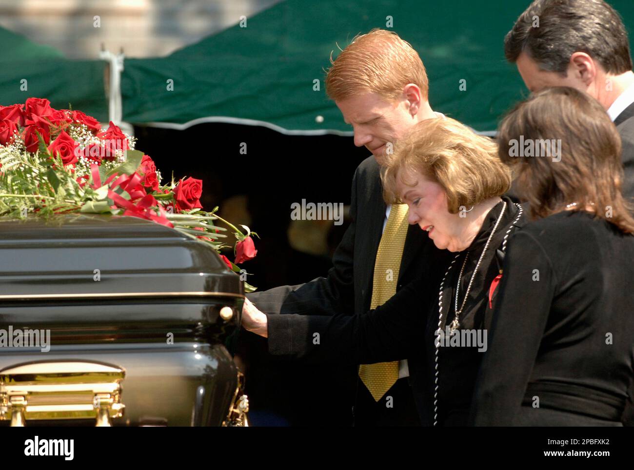 Macel Falwell touches the casket of her late husband, Rev.Jerry Falwell ...