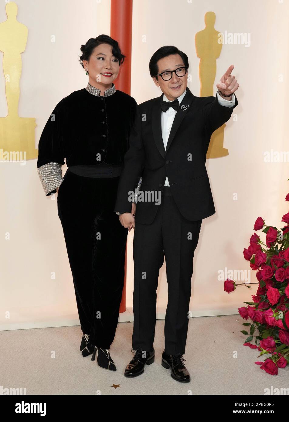 Echo Quan, left and Ke Huy Quan arrive at the Oscars on Sunday, March ...